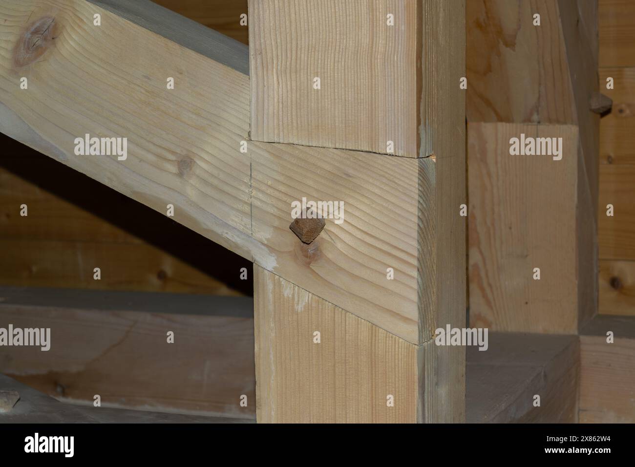 Detailed view of wooden beam structure joint in an architectural ...