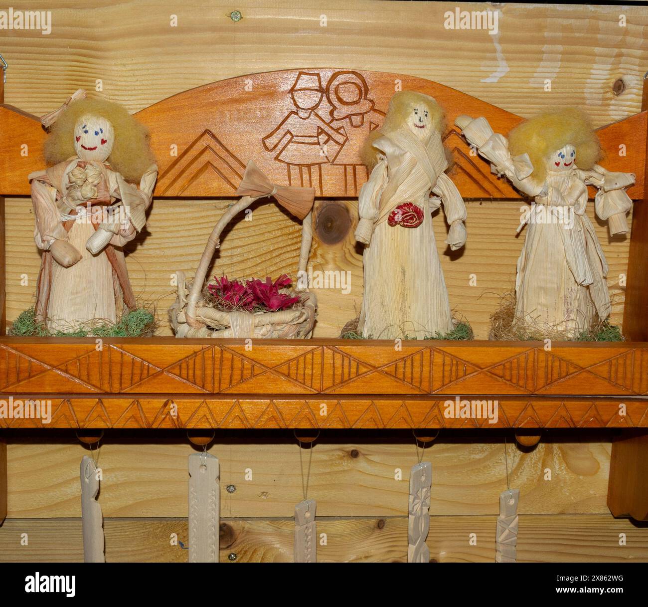 Handmade Straw Dolls on Wooden Shelf with Traditional Design Stock ...
