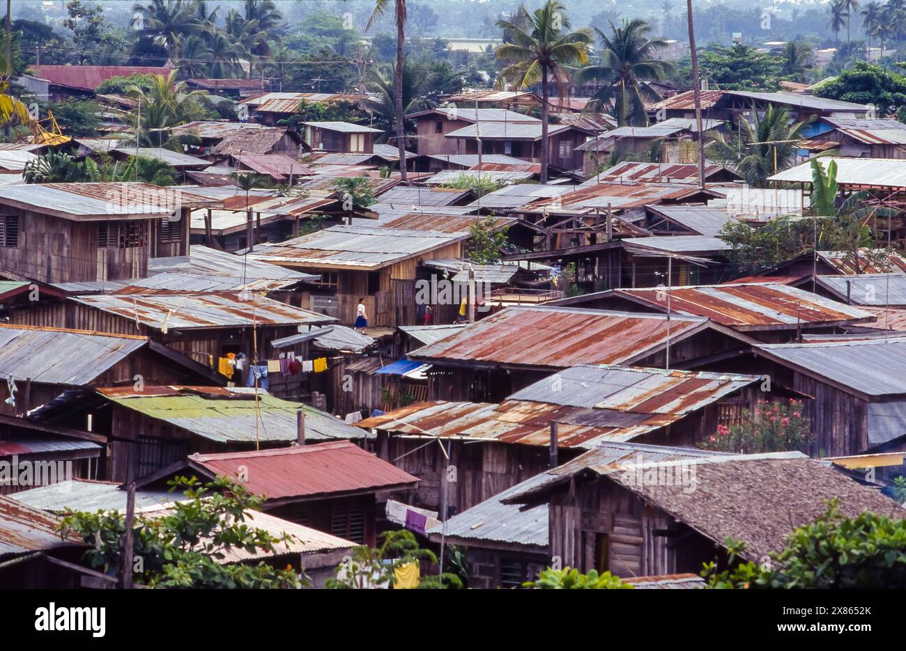 Philippines, Manila; corrugated iron roofs of houses in a slum Stock ...