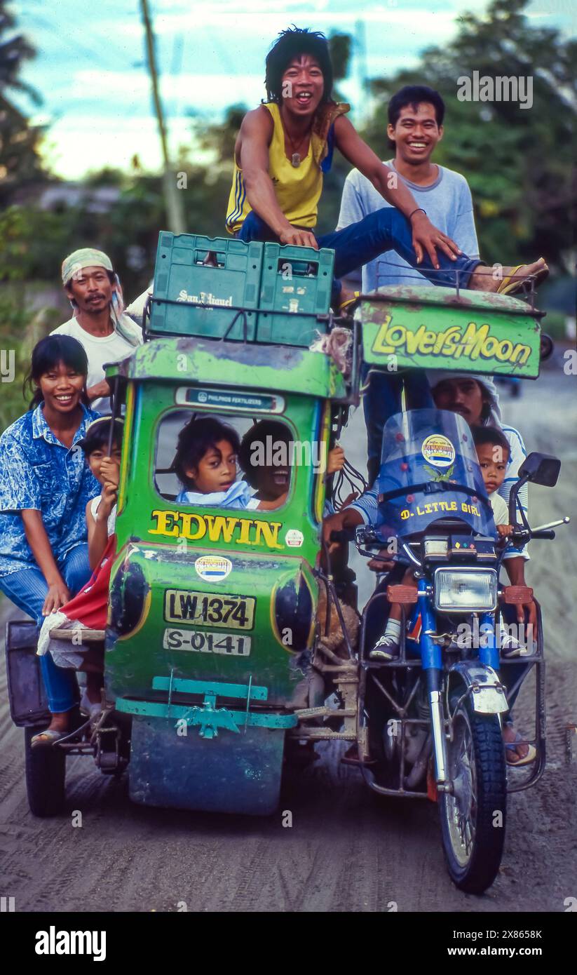 Philippines, Mindanao; motorcycle with sidecar taxis or tricycles can ...