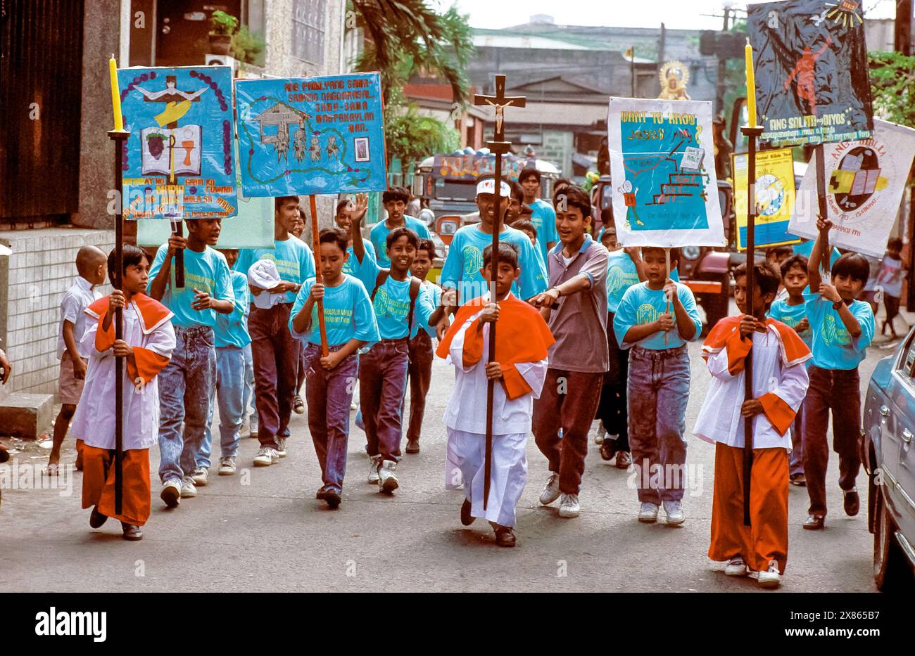 Philippines, Manila; Children walking in a catholic procession Stock ...