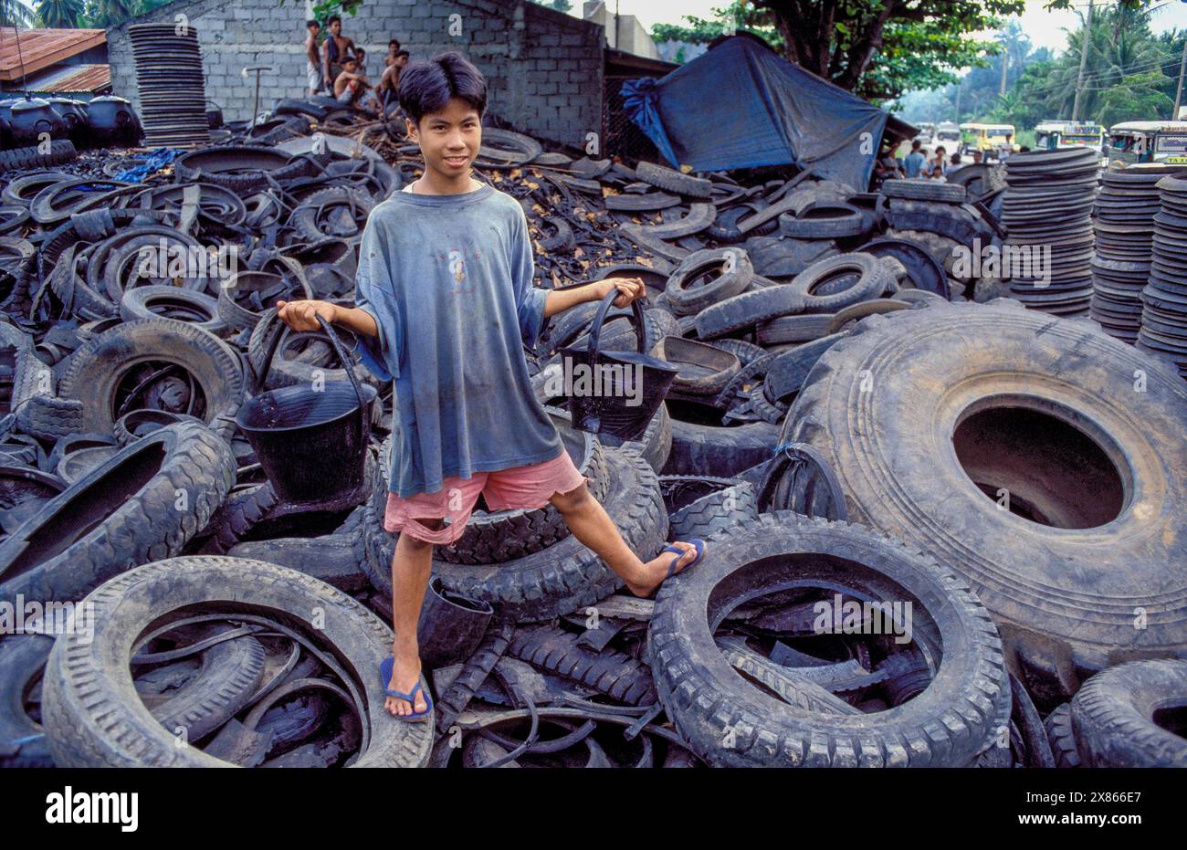 Philippines, Mindanao - in the village of Kilate, children work at a ...
