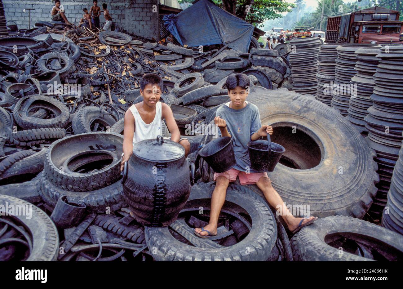 Philippines, Mindanao - in the village of Kilate, children work at a ...