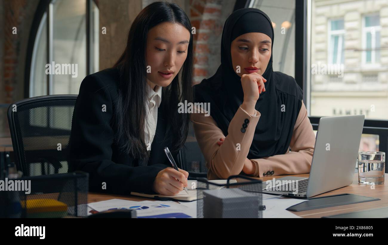 Two multiracial girls business women diversity multiethnic ...