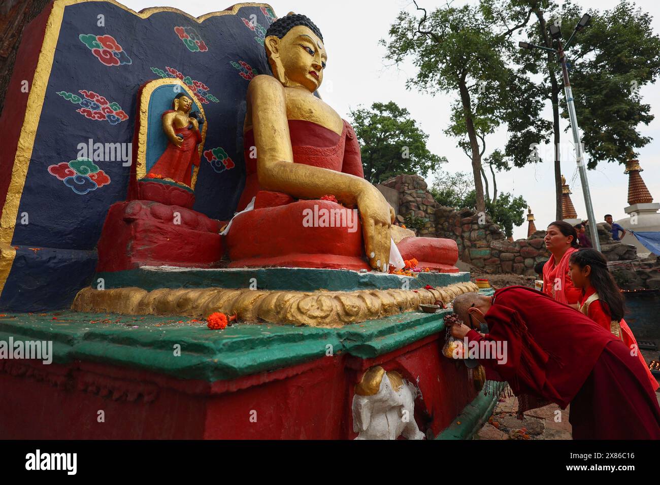 Kathmandu, Nepal. 23rd May, 2024. A monk performs a ritual to mark ...