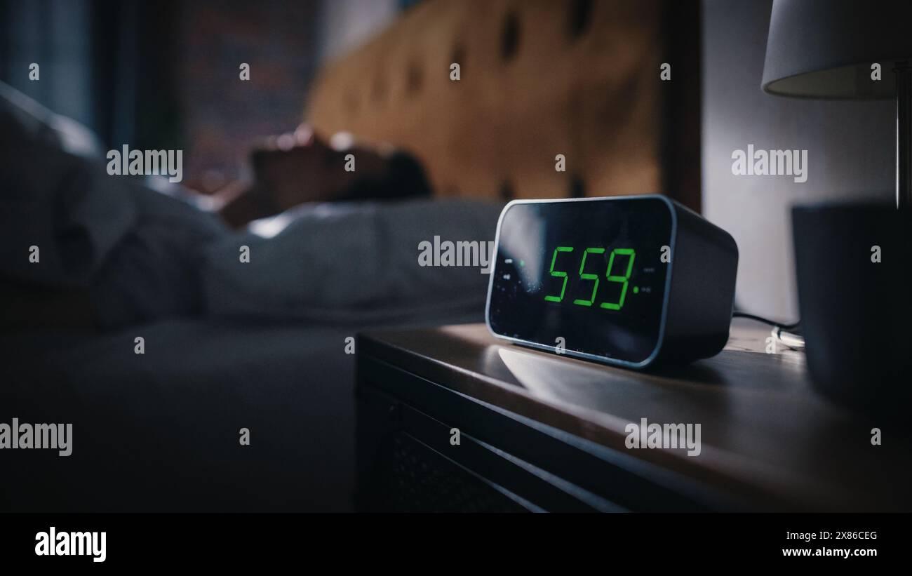 Handsome Man Wakes Up and Turns off Alarm Clock. Proceeds to Have a ...