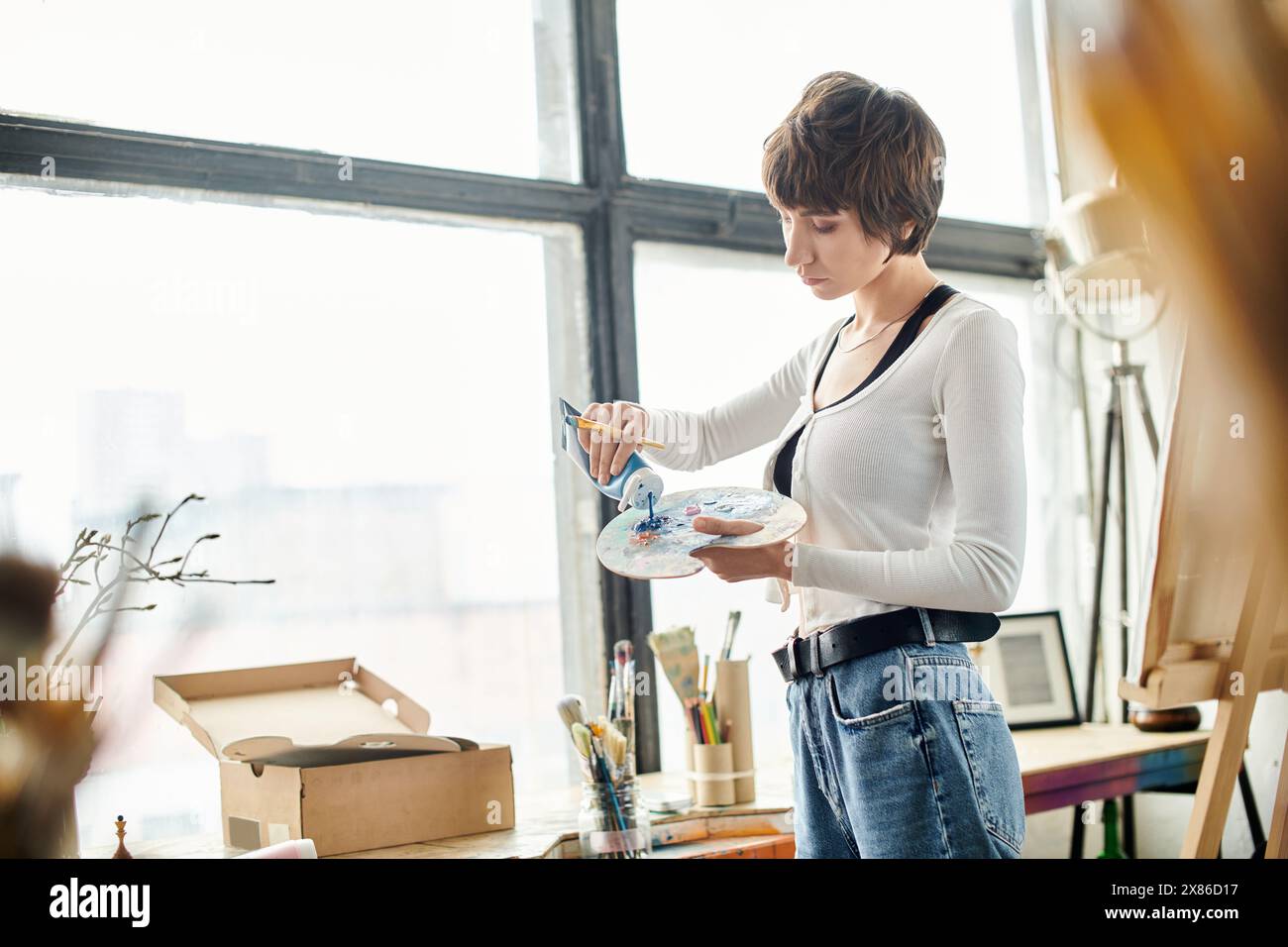 Young artist stands in hi-res stock photography and images - Alamy