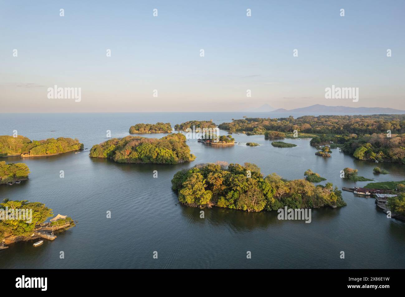 Lake coast landscape with mountain volcano background aerial drone view ...