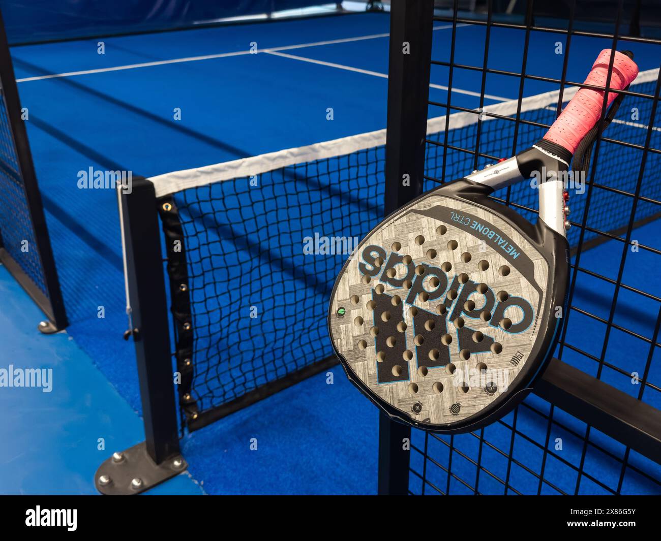 Ukraine Kyiv, May 23 2024. paddle tennis racket and balls on the blue ...