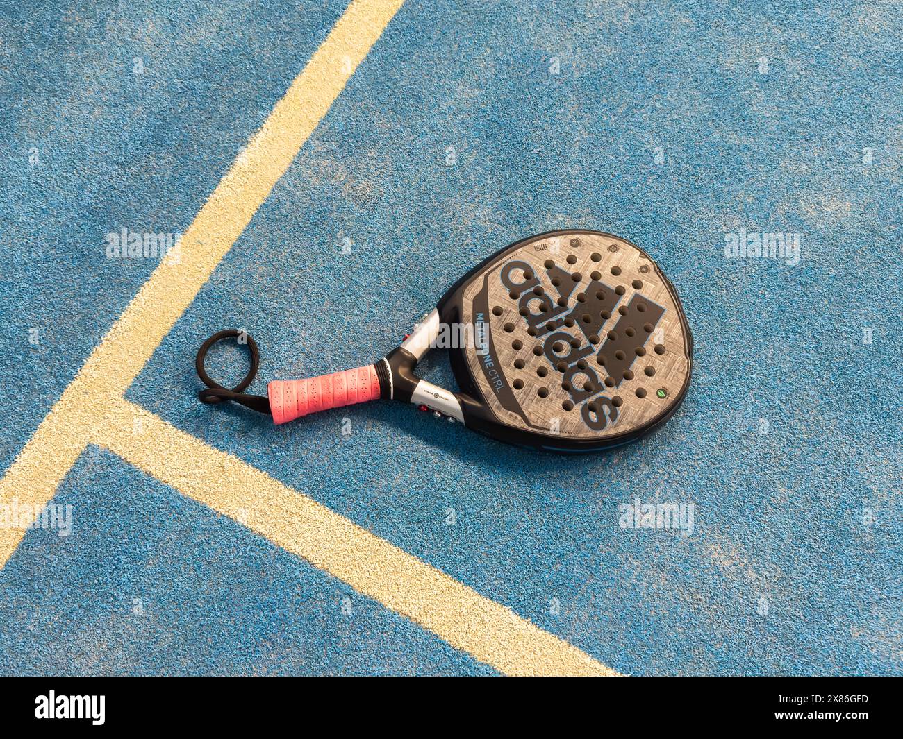 Ukraine Kyiv, May 23 2024. paddle tennis racket and balls on the blue ...
