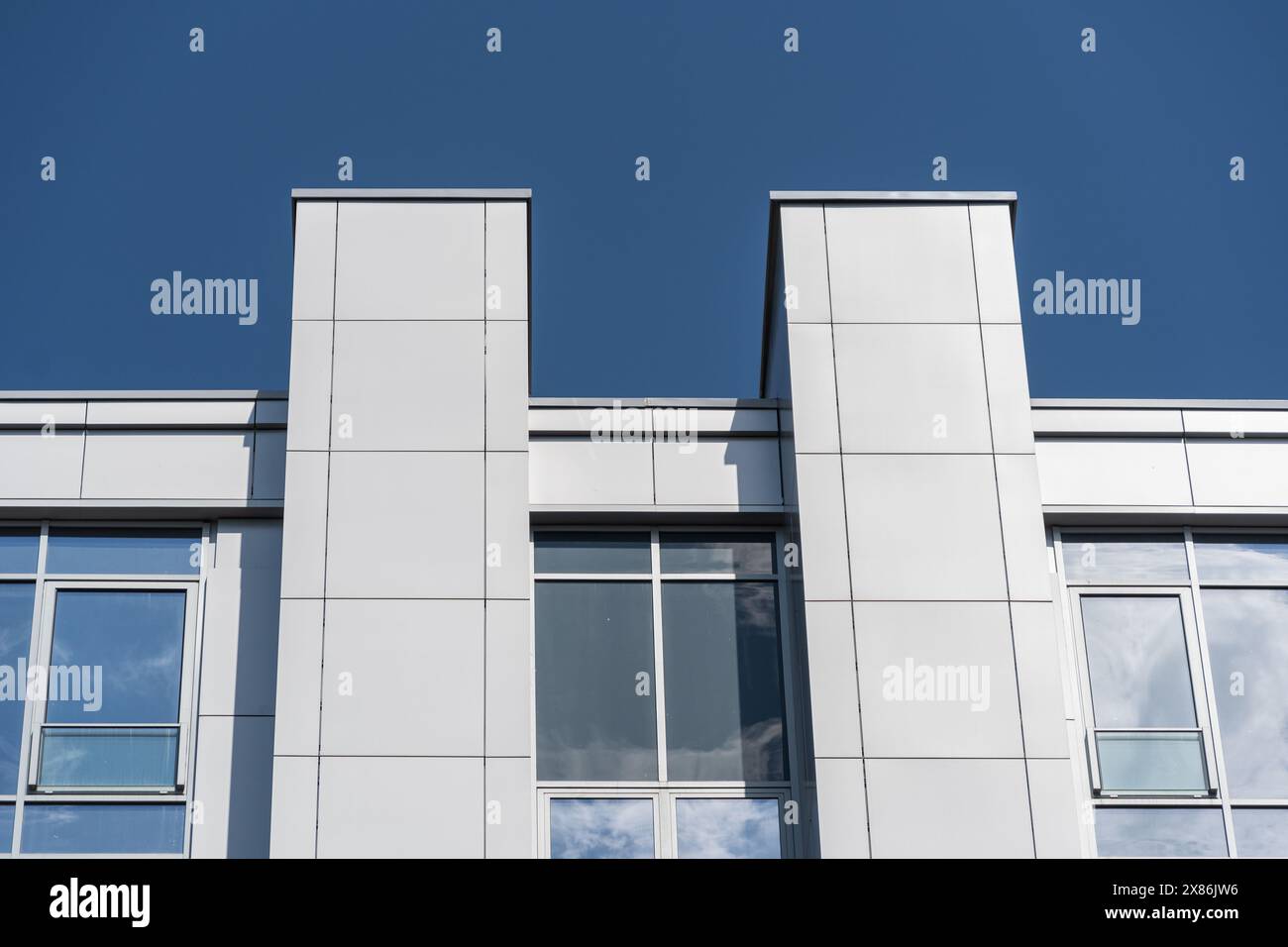 New building facade in housing complex. Modern style in architecture ...