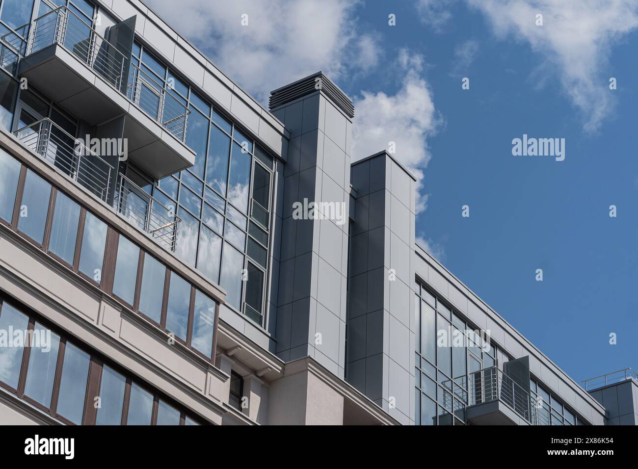 New building facade in housing complex. Modern style in architecture ...