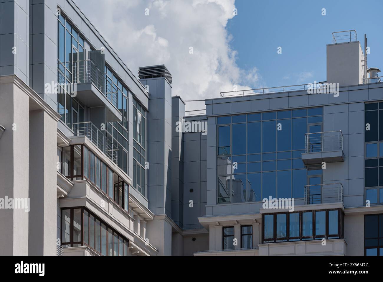 New building facade in housing complex. Modern style in architecture ...