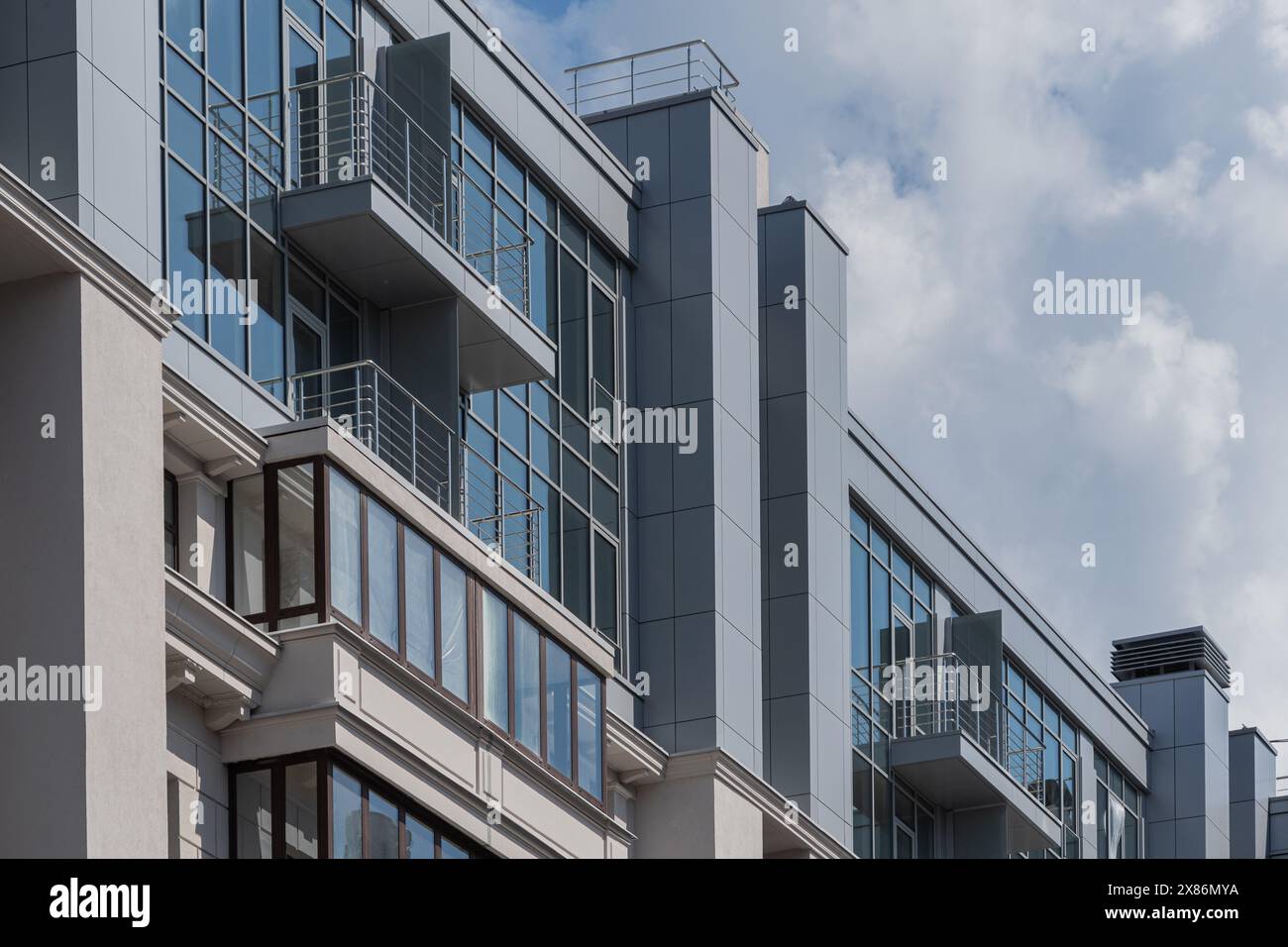 New building facade in housing complex. Modern style in architecture ...