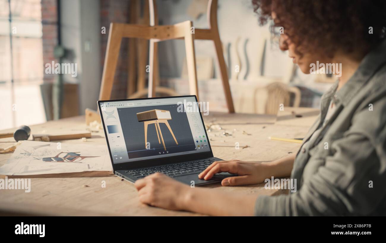 Furniture Designer Working on Laptop Computer, Creating a Digital 3D Model of a Stylish Wooden ...