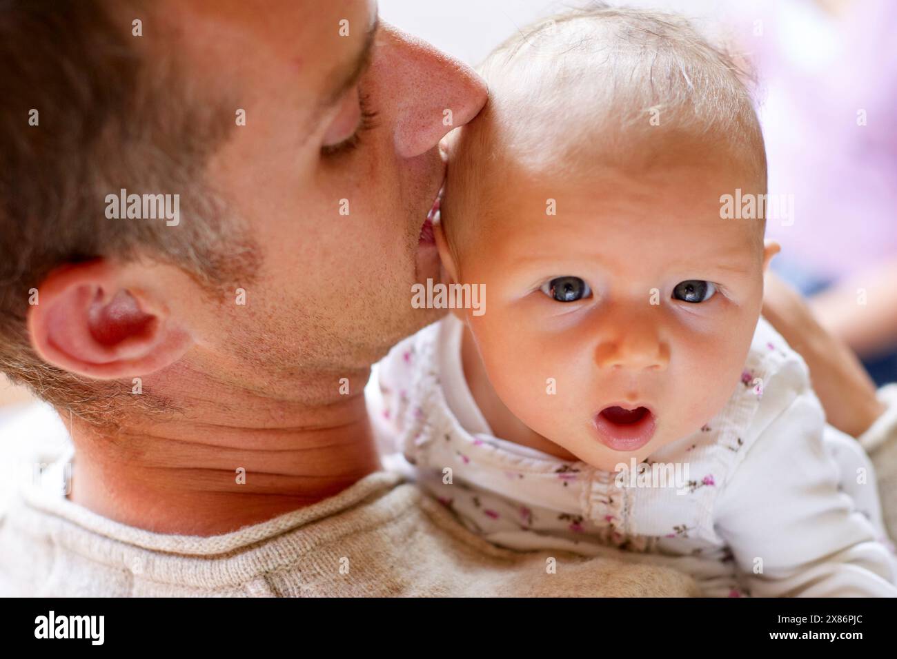 Father holding newborn baby Stock Photo - Alamy
