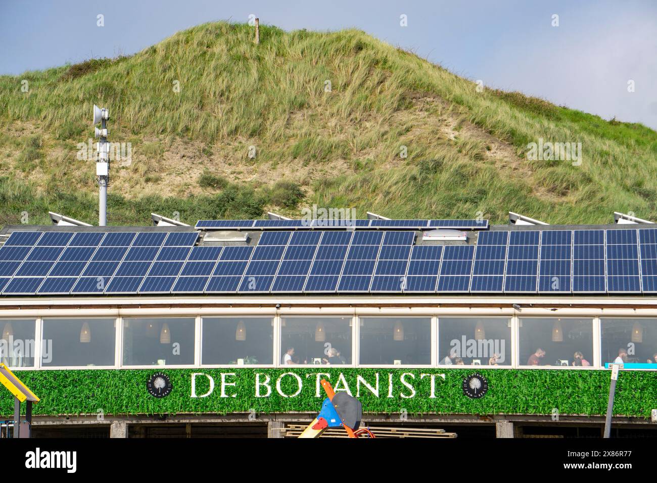 Solar modules on roofs, on the roof of a beach restaurant in Zeeland ...