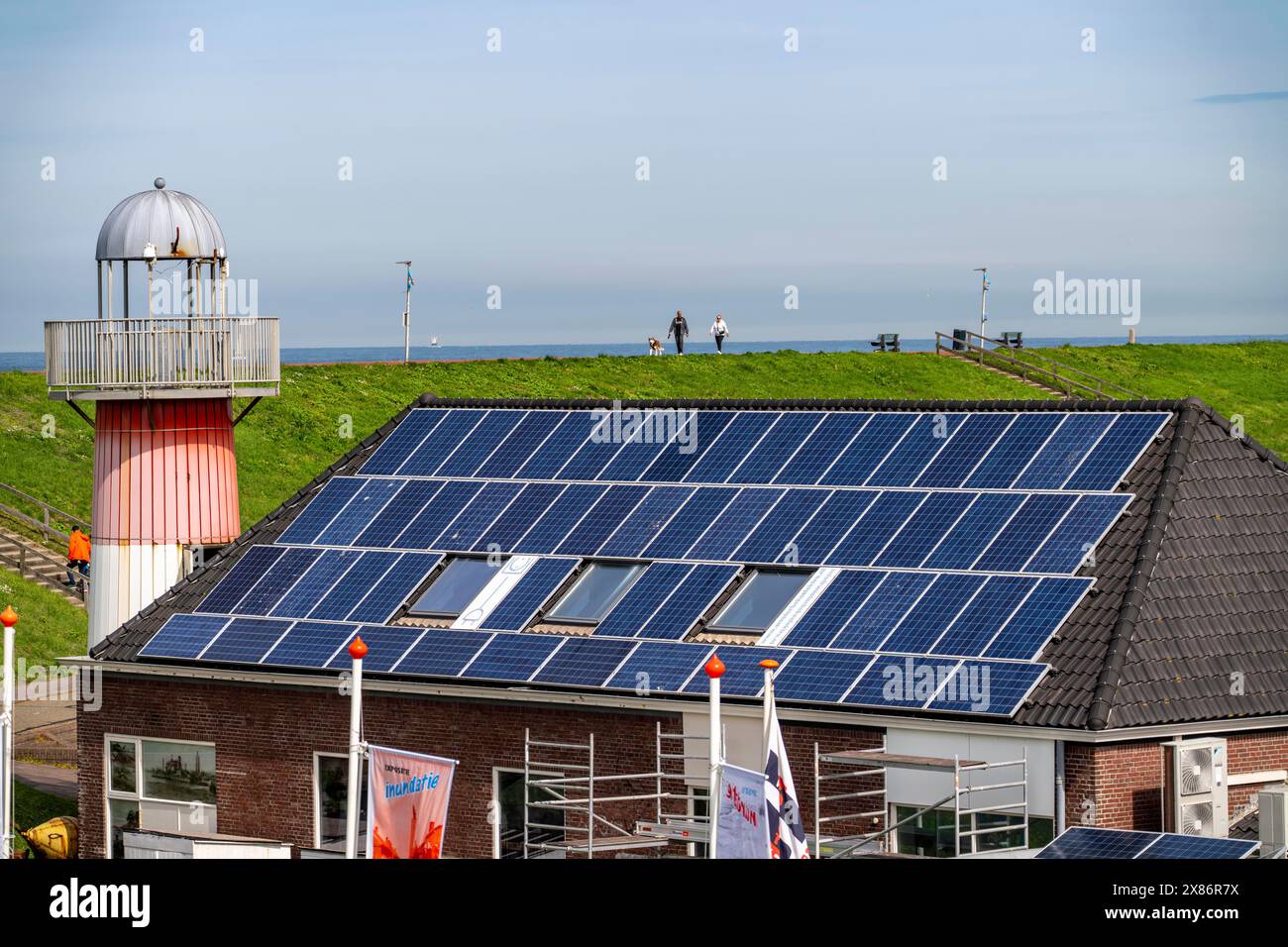 Solar modules on roofs, on the roof of a building on the dike, North ...