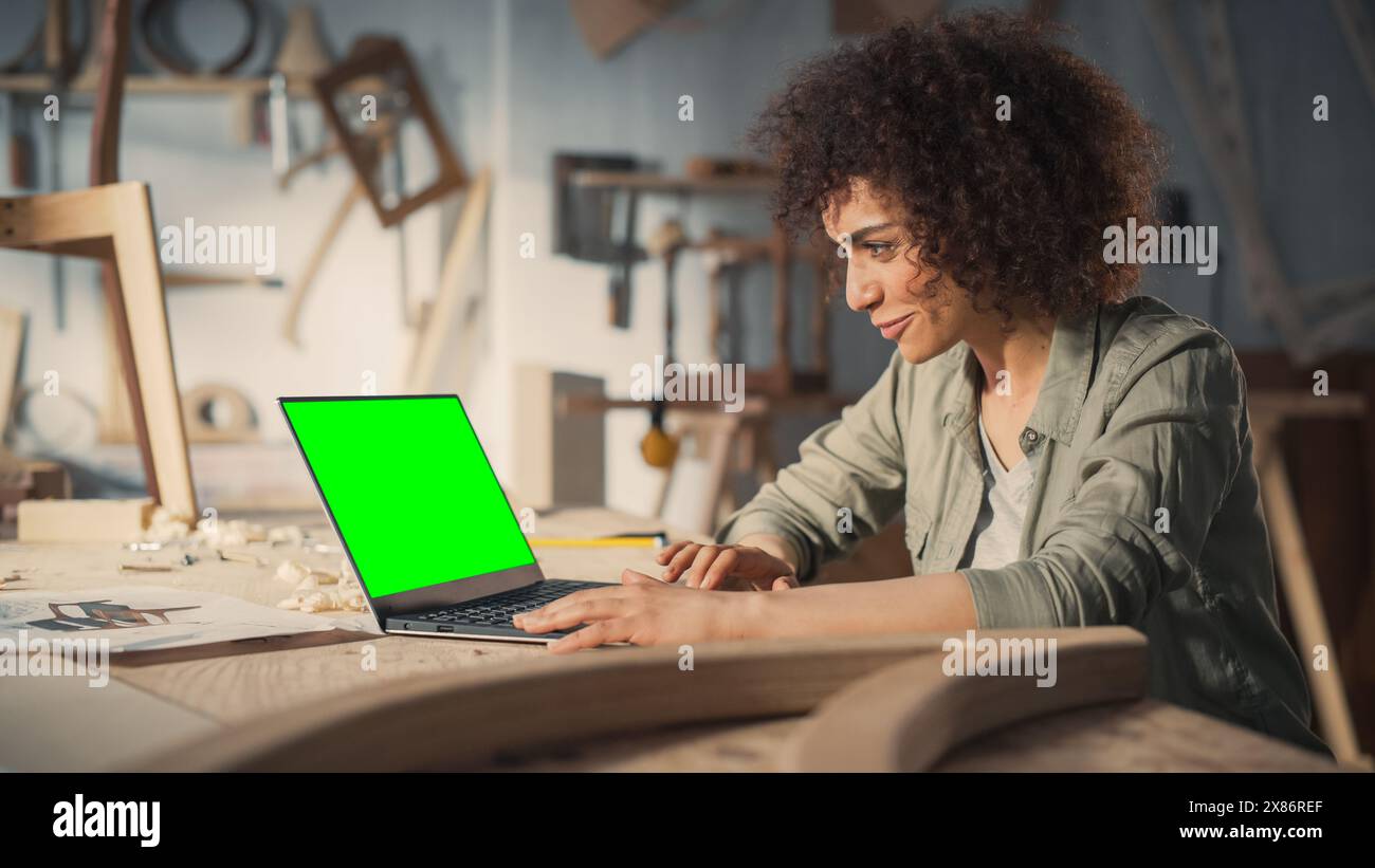 Over the Shoulder Shot of a Furniture Designer Working on Laptop ...