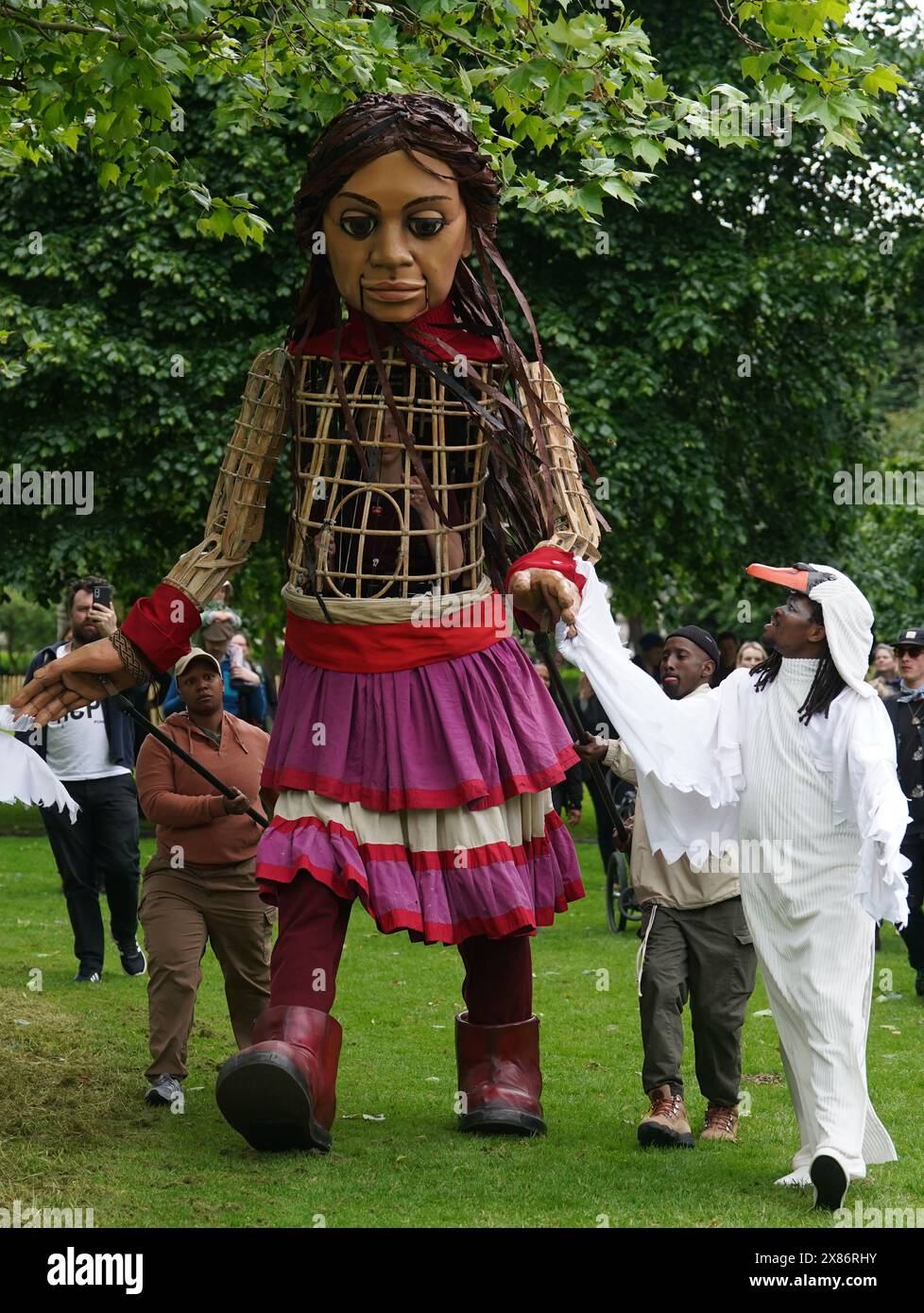 Little Amal, a 12-foot tall puppet of a ten-year-old Syrian refugee ...