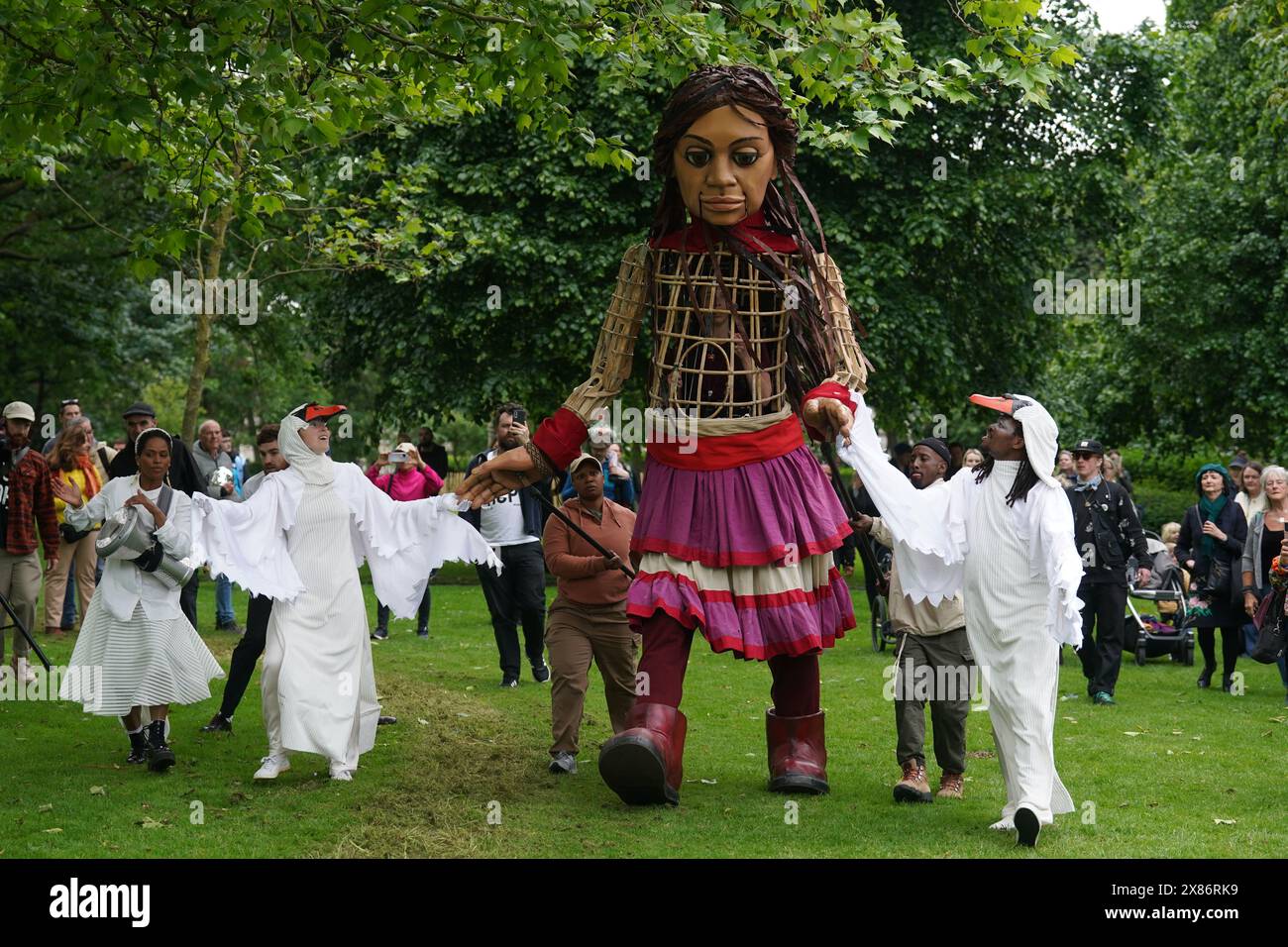 Little Amal, a 12-foot tall puppet of a ten-year-old Syrian refugee ...