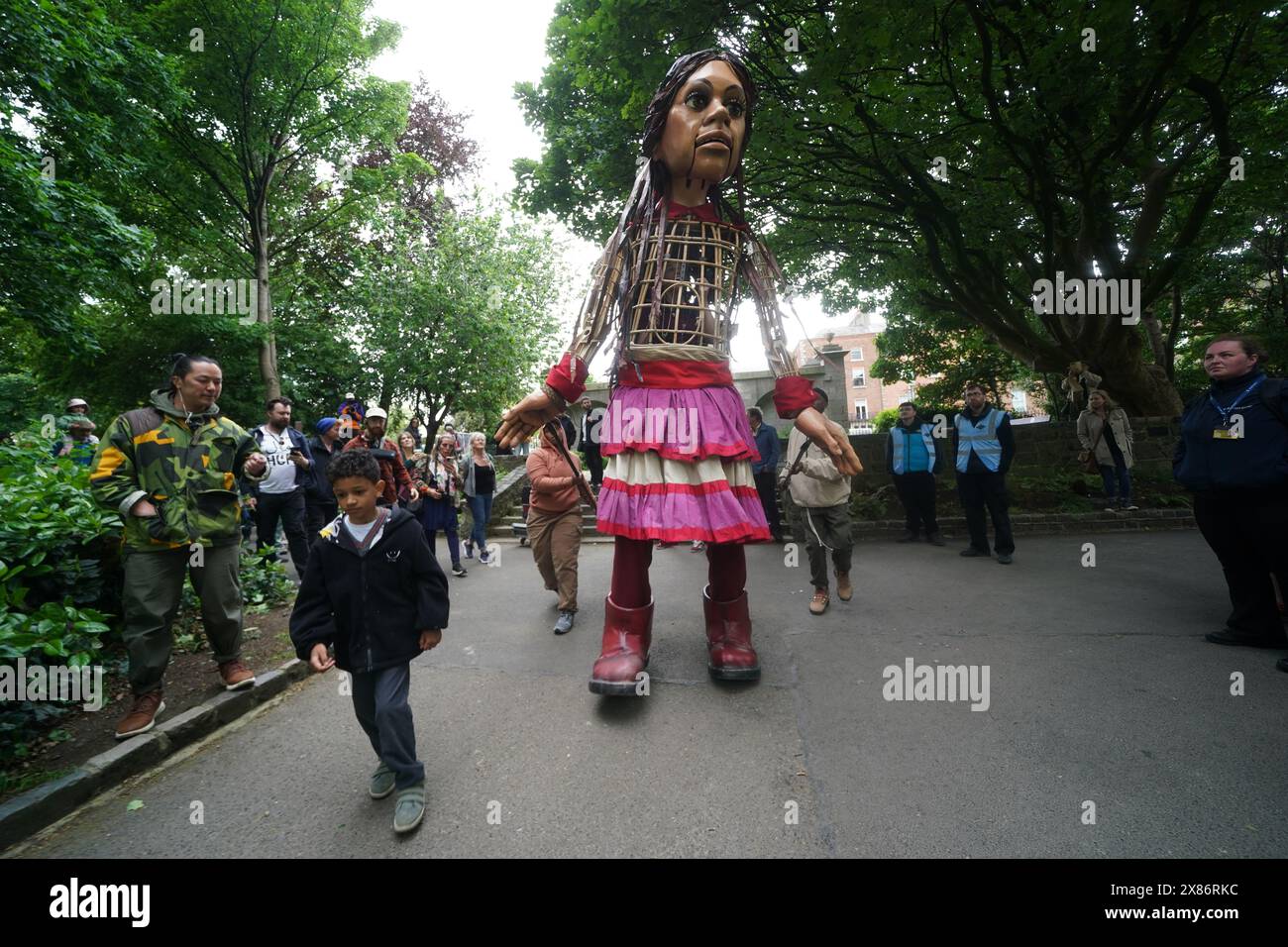 Little Amal, a 12-foot tall puppet of a ten-year-old Syrian refugee ...