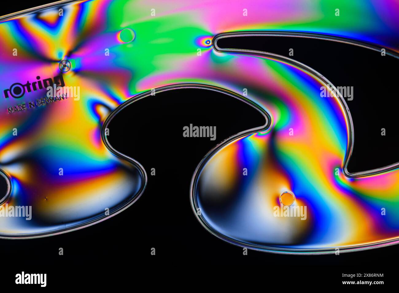 Detail from a Rotring clear plastic french curve drawing aid viewed ...