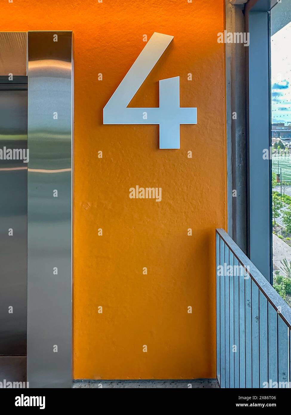 Floor level 4 in a parking ramp, garage, car parking with a large white ...