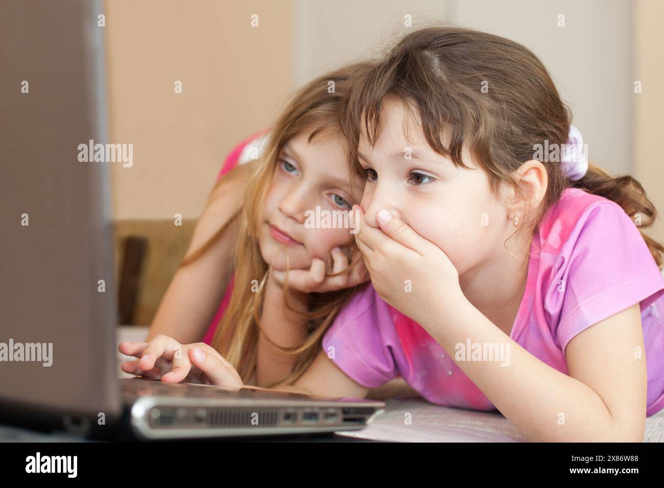 two little girls using computer Stock Photo - Alamy