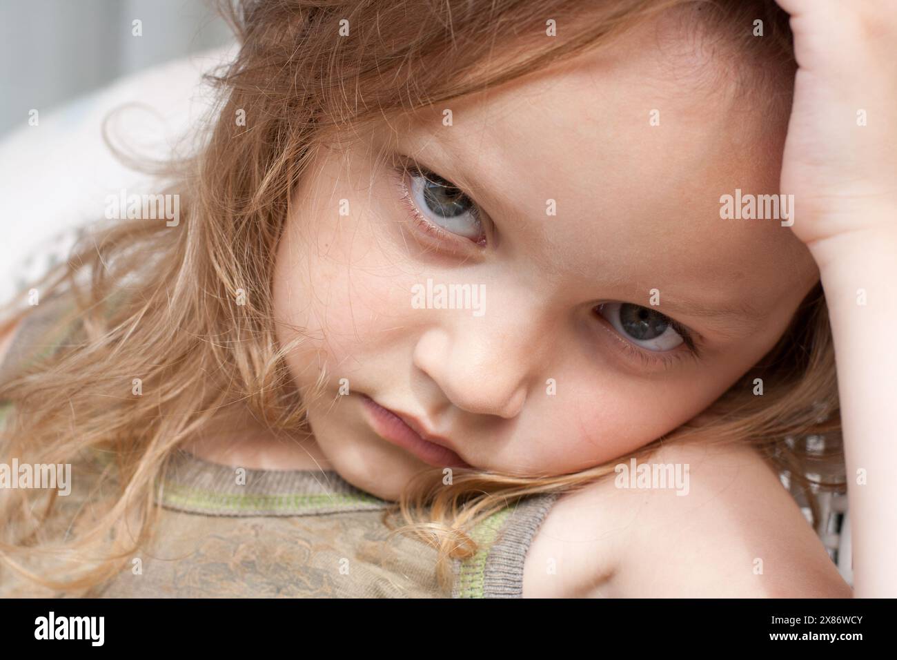 close up of grumpy sad little girl looking at camera Stock Photo - Alamy