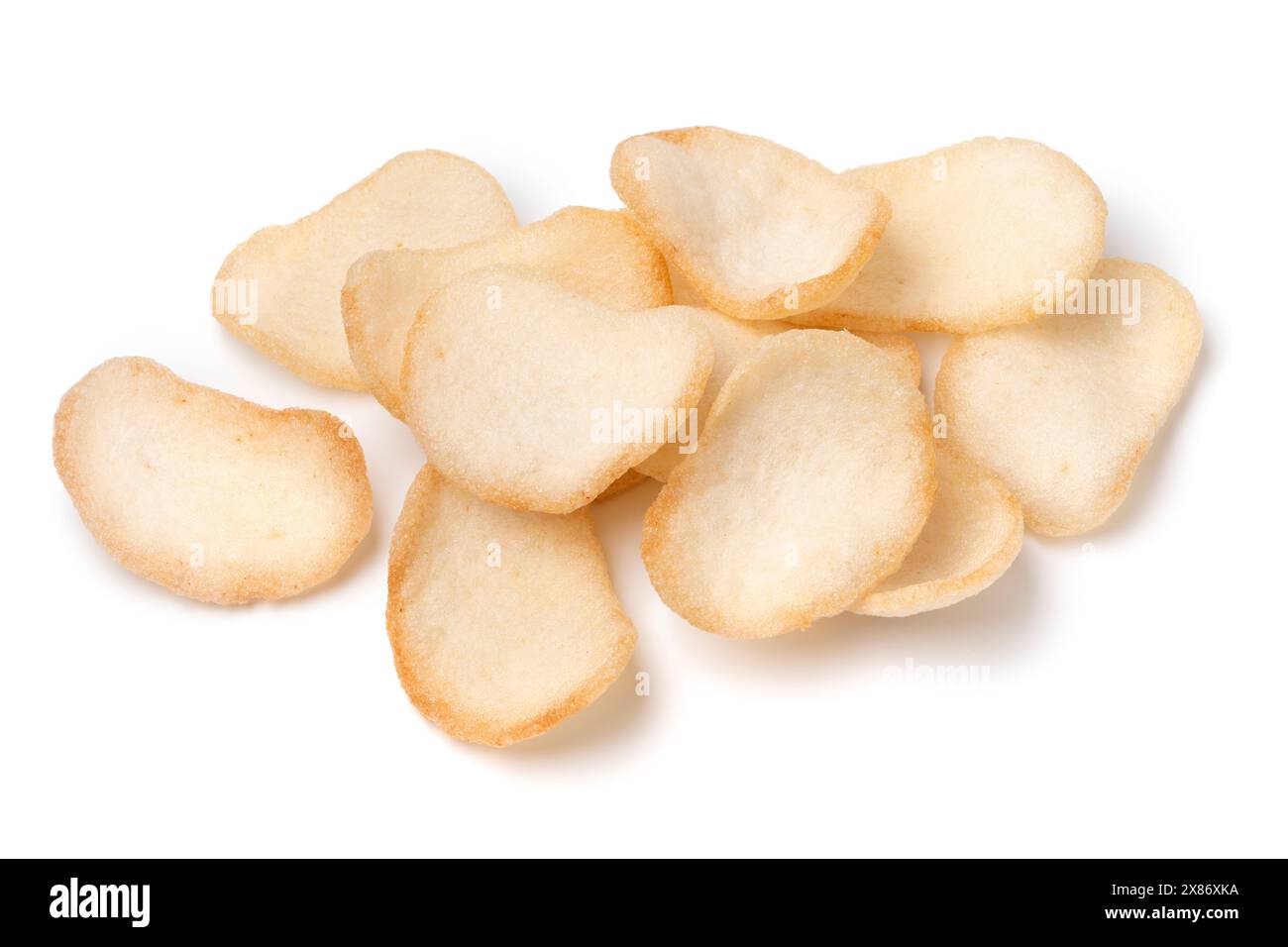 Heap of fresh baked Indonesian shrimp krupuk close up isolated on white ...
