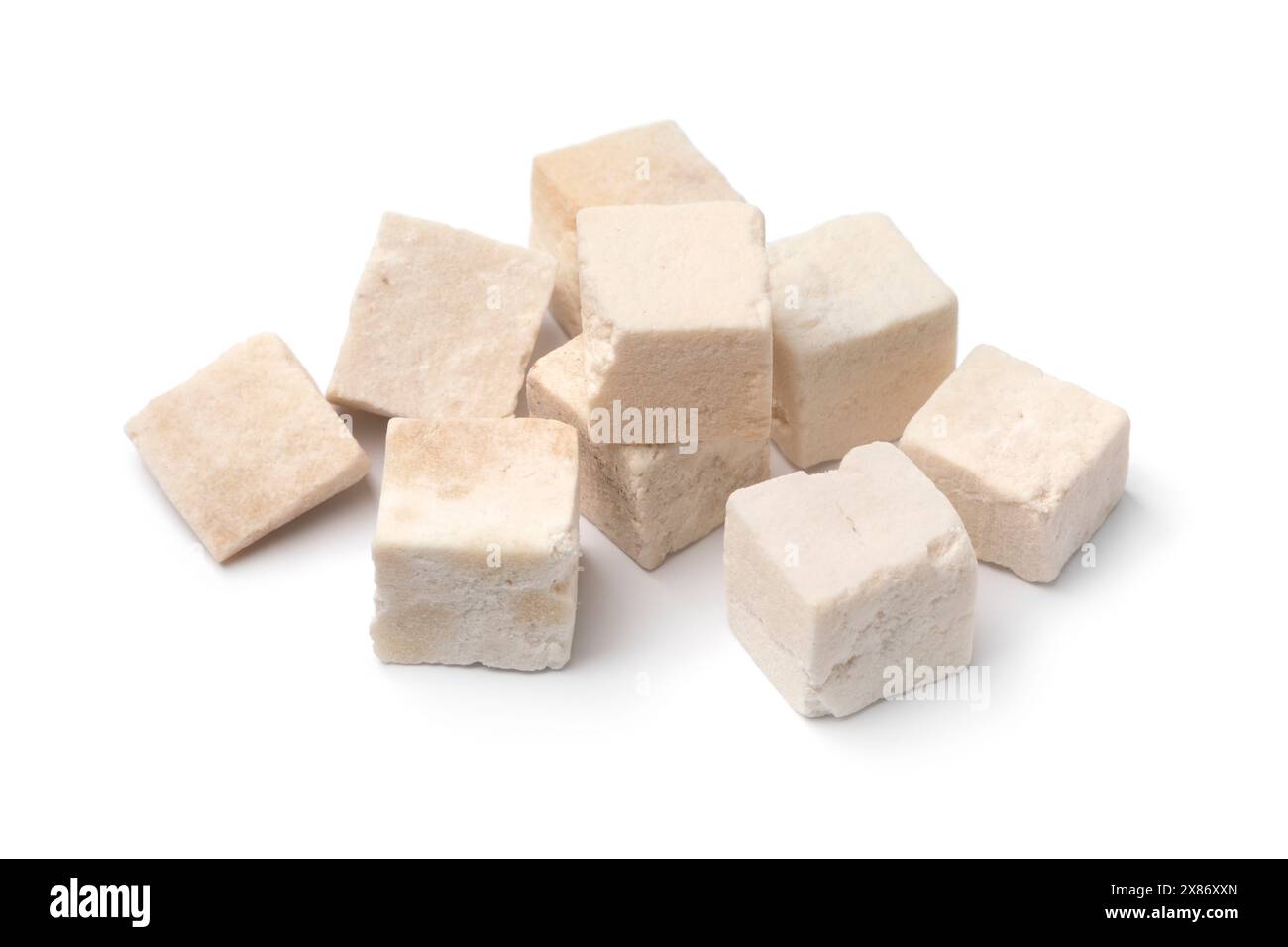 Dried cubes of Wolfiporia extensa close up isolated on white background ...