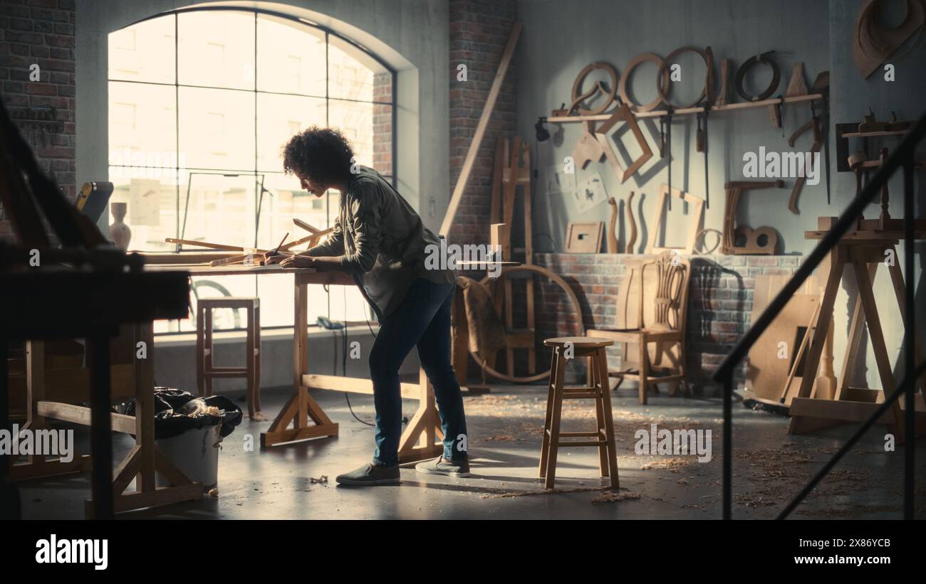 Multiethnic Artisan Woodworker Marking Out Dimensions on a Blueprint ...