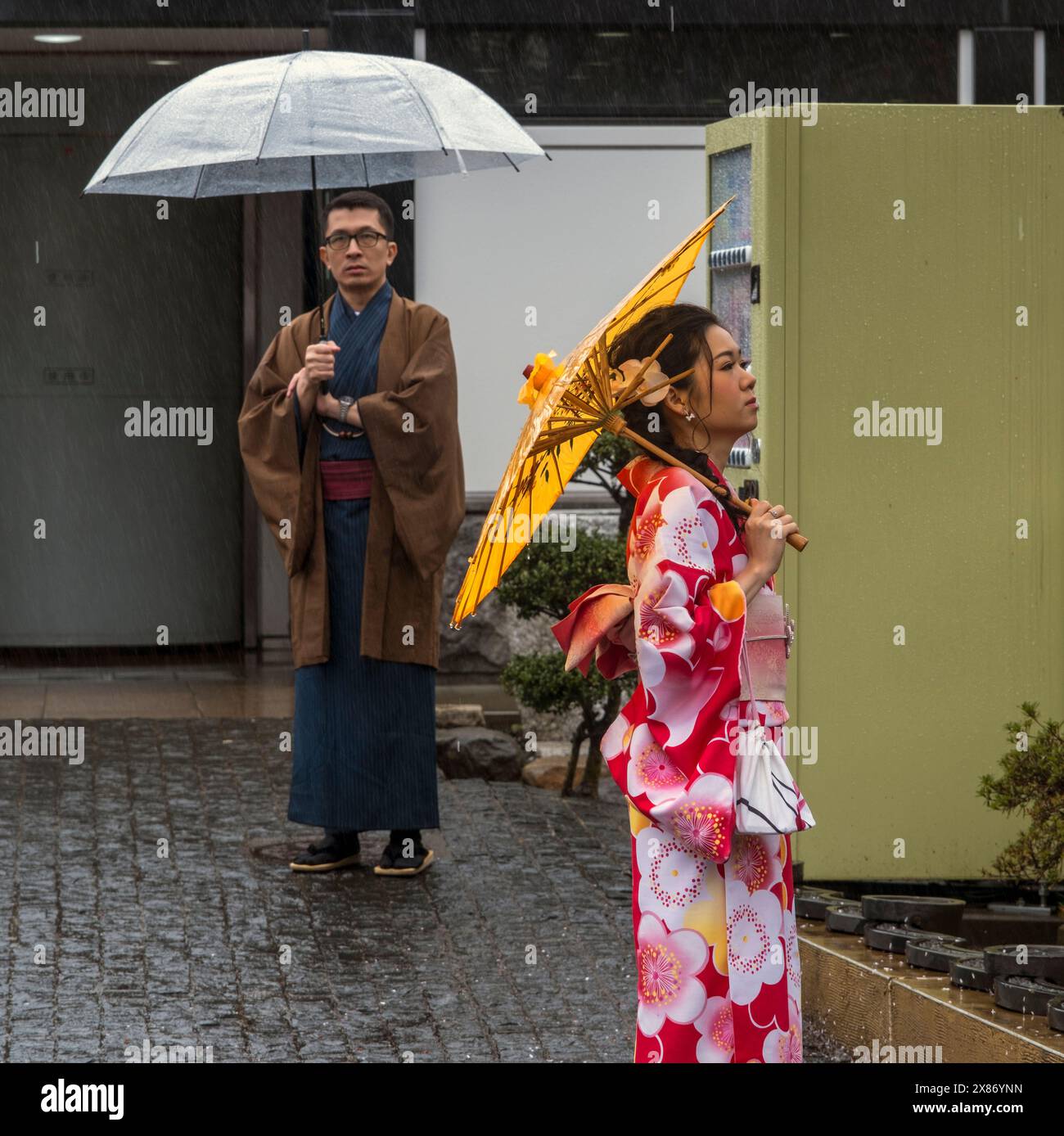 Japanese wearing traditional dress in the rain, Tokyo, Japan Stock ...