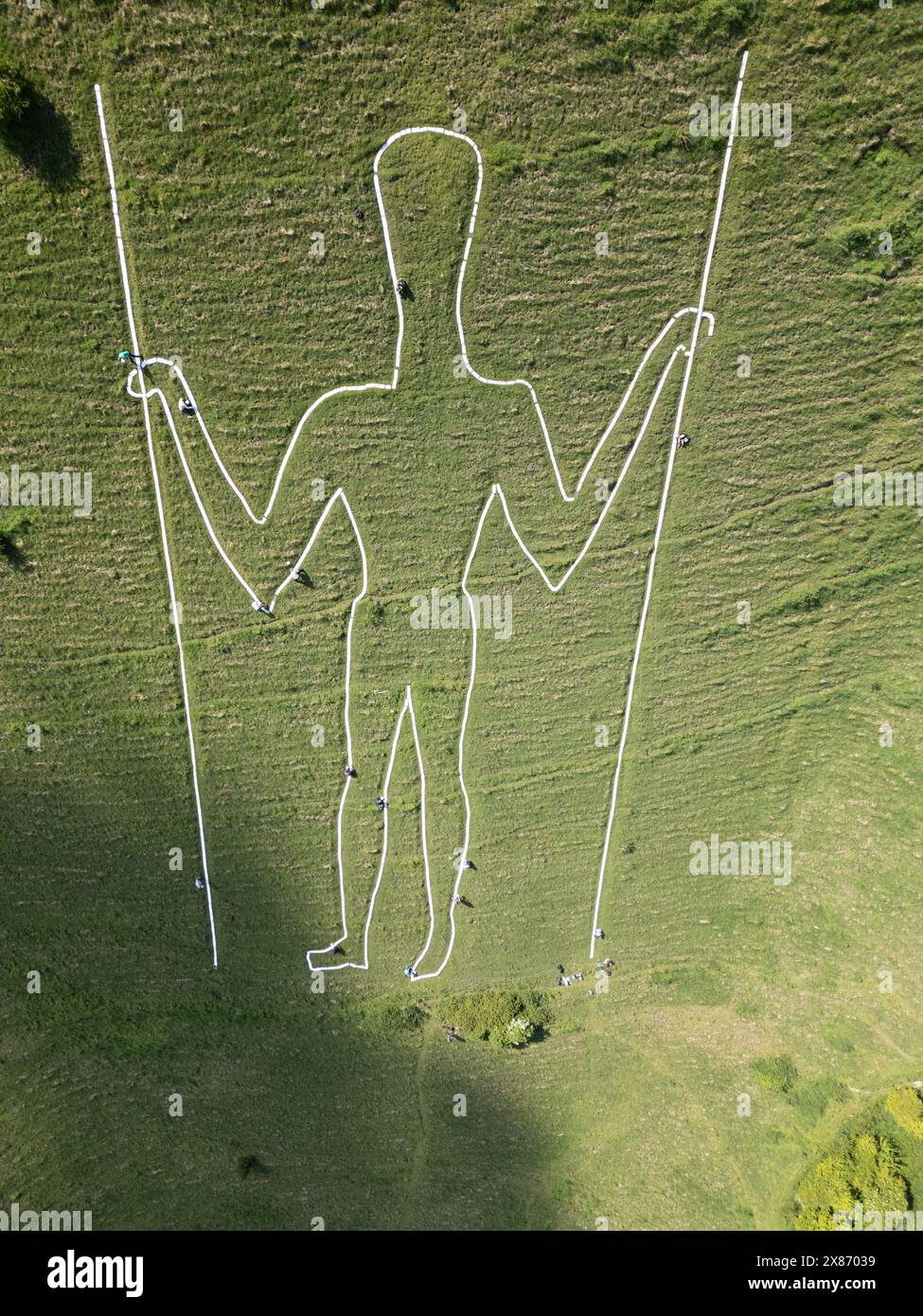 Volunteers below paint the long man of wilmington hi-res stock ...