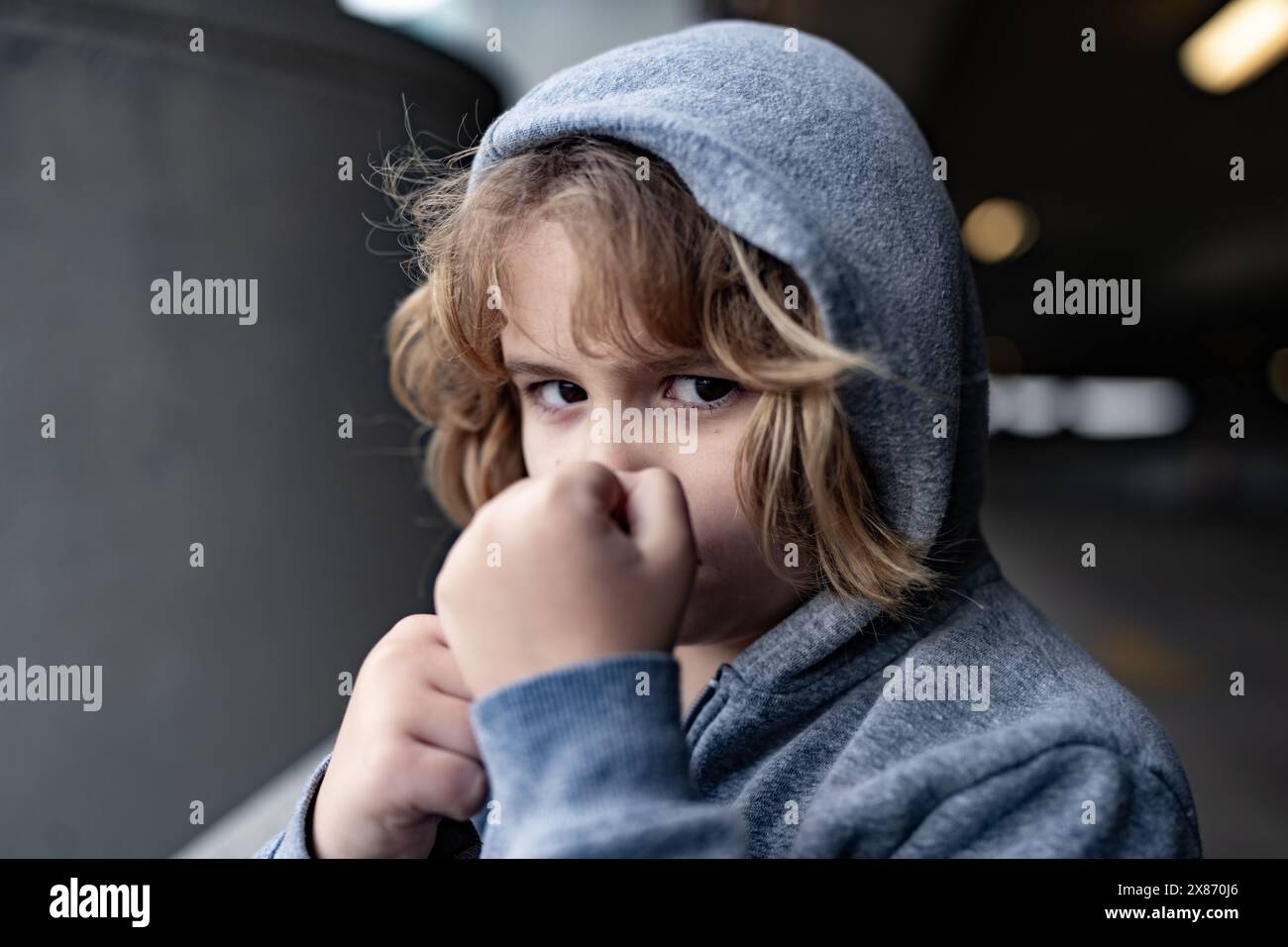 Aggressive child. Aggression kid boy fighting on street. Angry ...