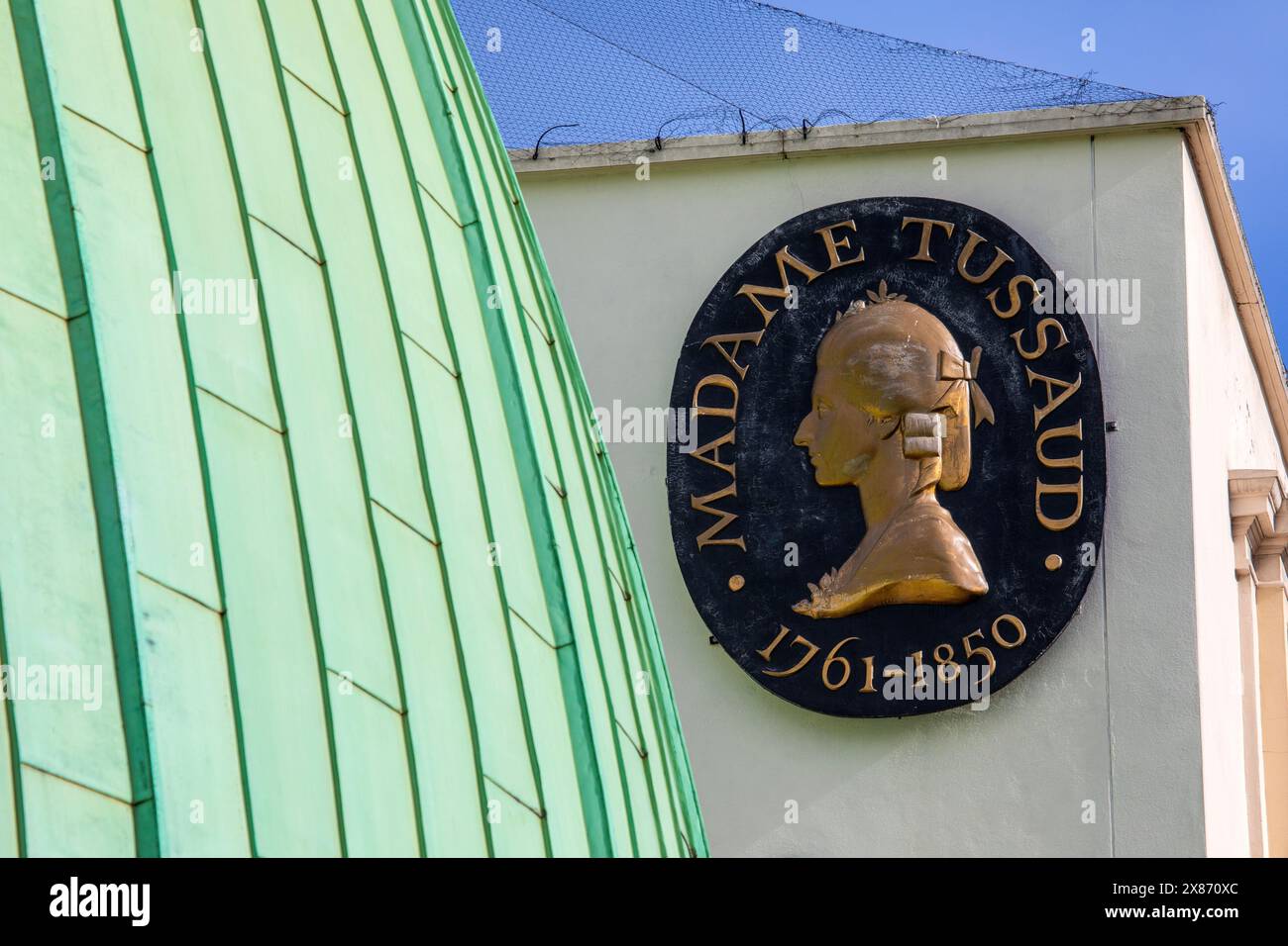 A plaque on the exterior of Madame Tussauds in London, UK ...