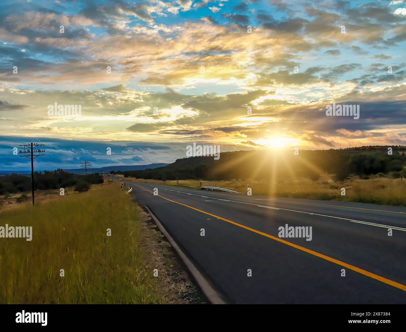 highway at sunsetm dusk light, in the african outback Stock Photo - Alamy