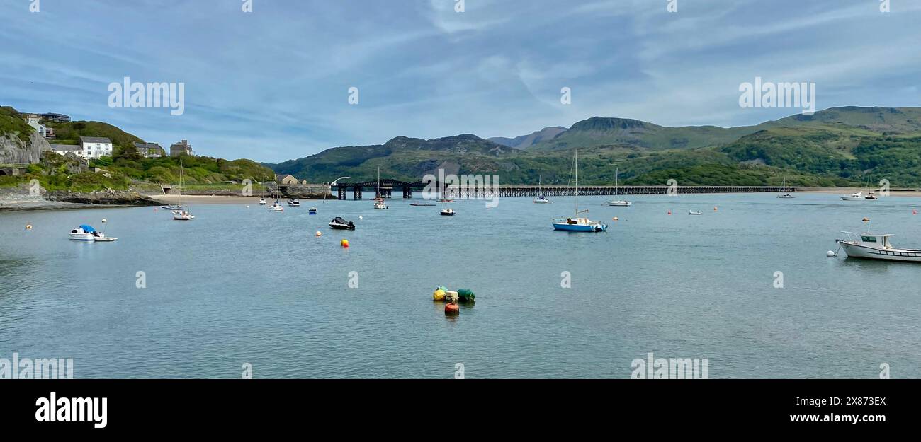 Barmouth Bridge, a wooden railway viaduct across the estuary of the ...