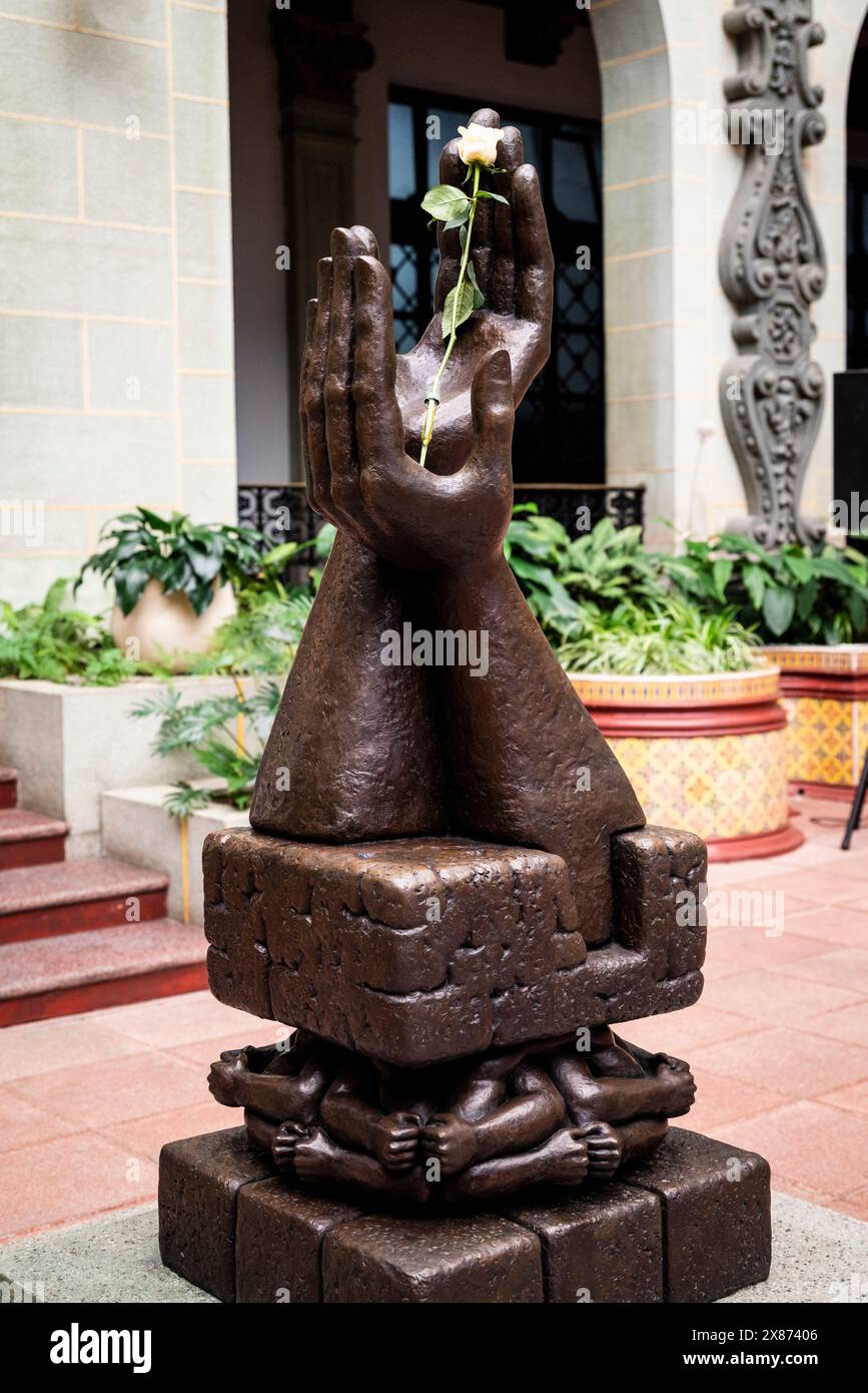 Monument to Peace, Sculpture of two hands holding a white rose in the ...