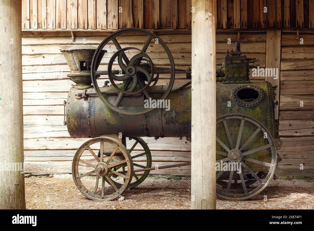 View of the antique rusty agricultural locomobile. steam train or ...
