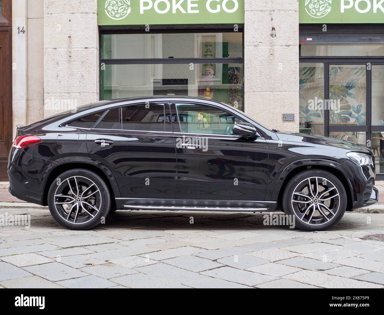 Cremona, Italy - May 5th 2024, Sleek black suv with shiny rims parked ...