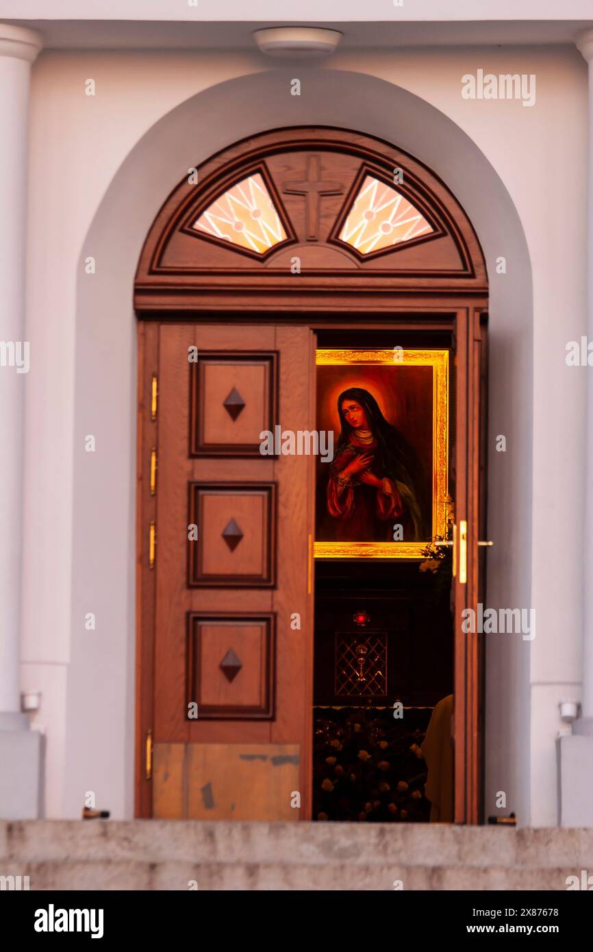 View of the open door to the church, a visible religious picture in the ...