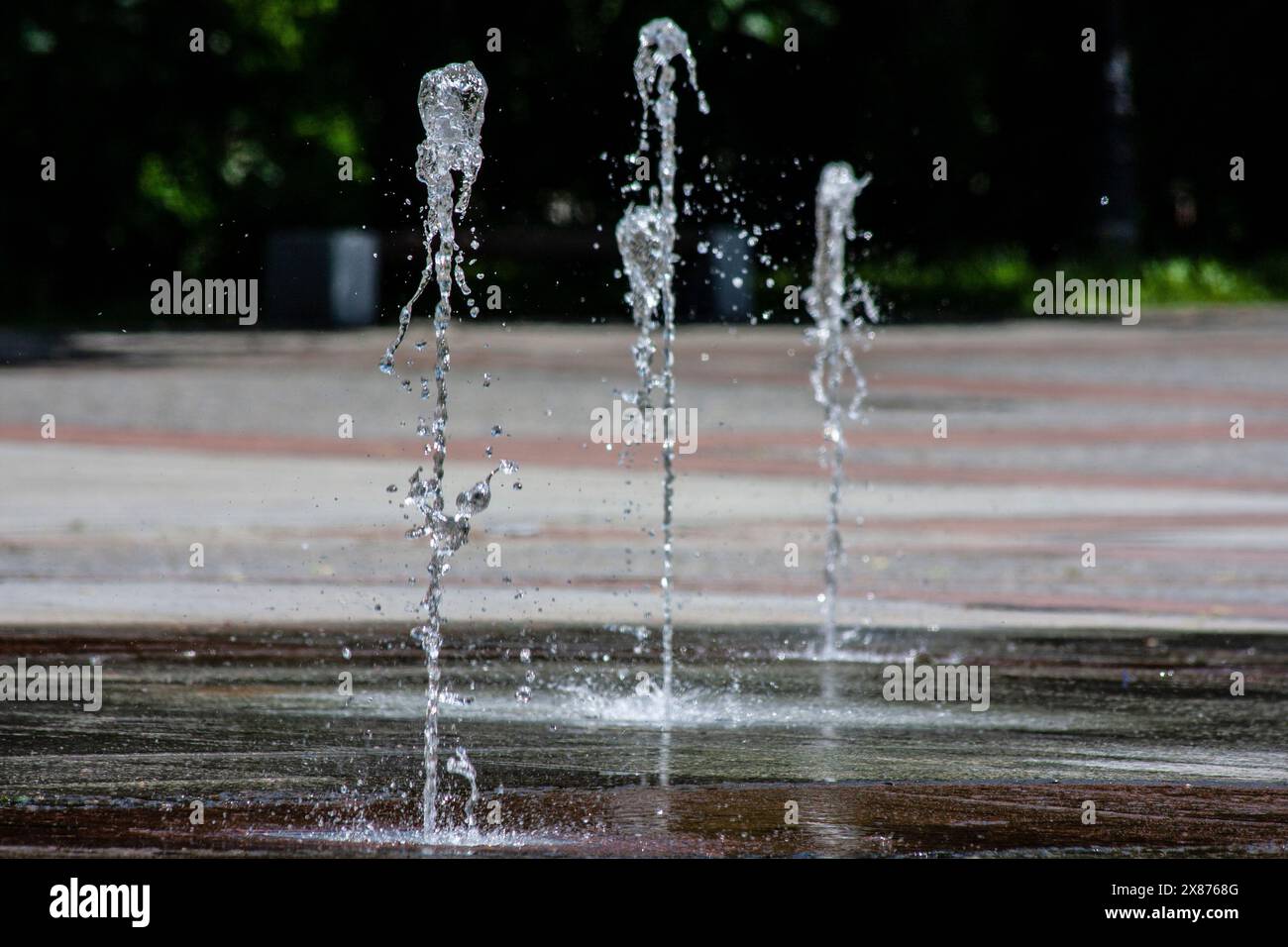 Water stream from the fountain, abstract shapes of water drops in close ...