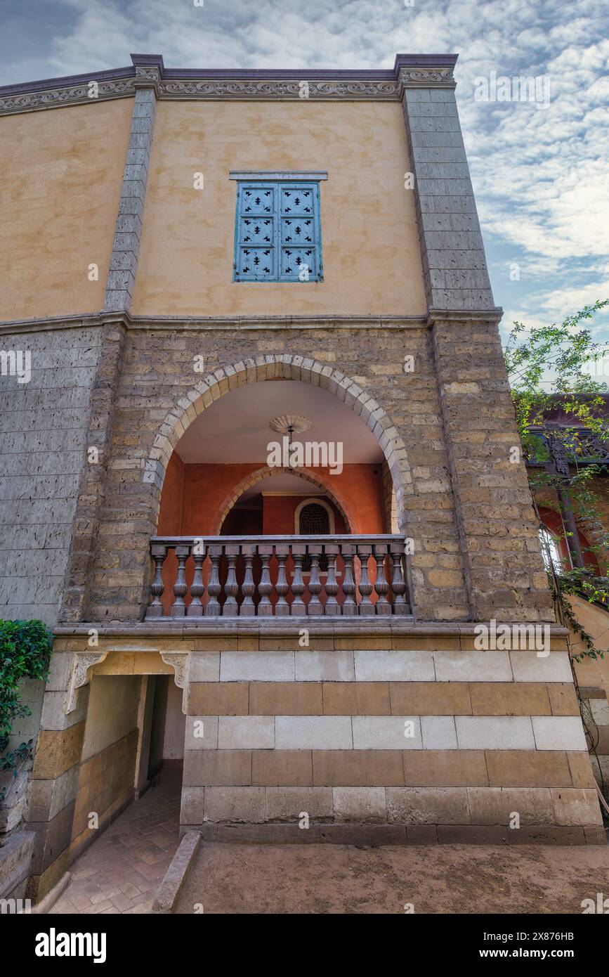 A serene view of a rustic style building featuring an arched wooden ...