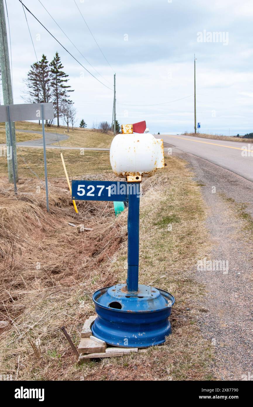 Homemade mailbox repurposed from a propane tank and other discarded ...