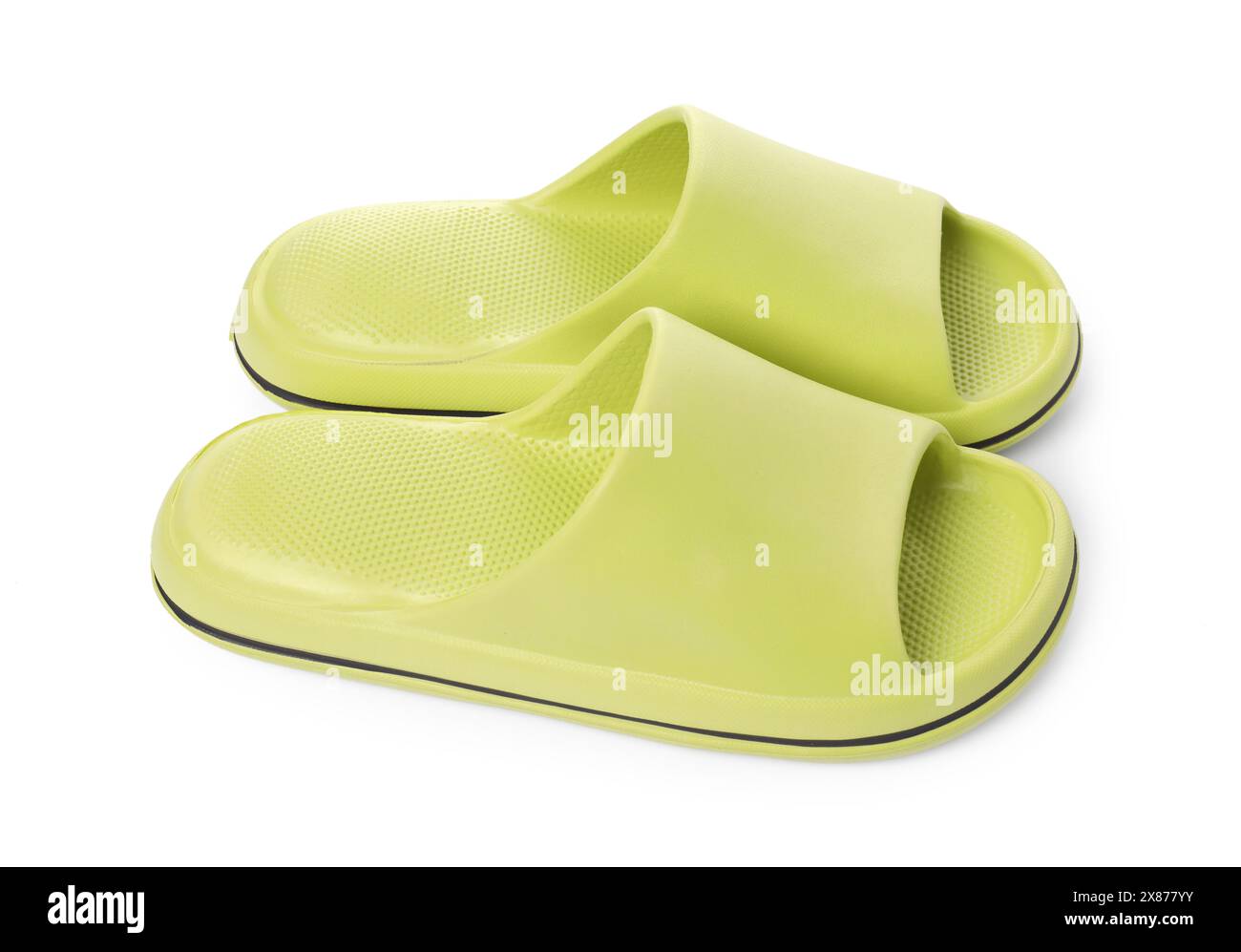 Pair of green rubber slippers isolated on white Stock Photo - Alamy