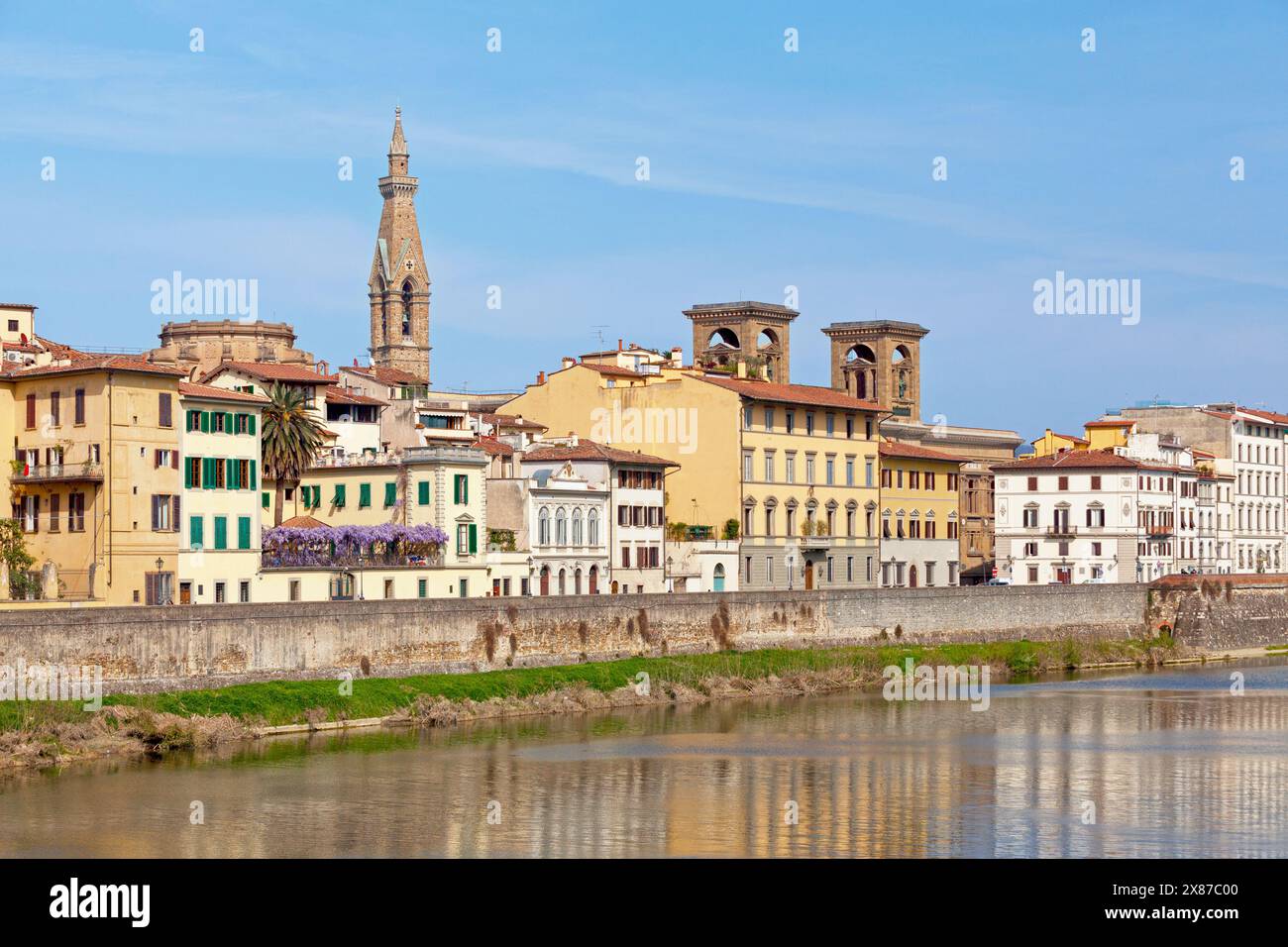 The Arno River with behind, the towers of the Florence National Central ...