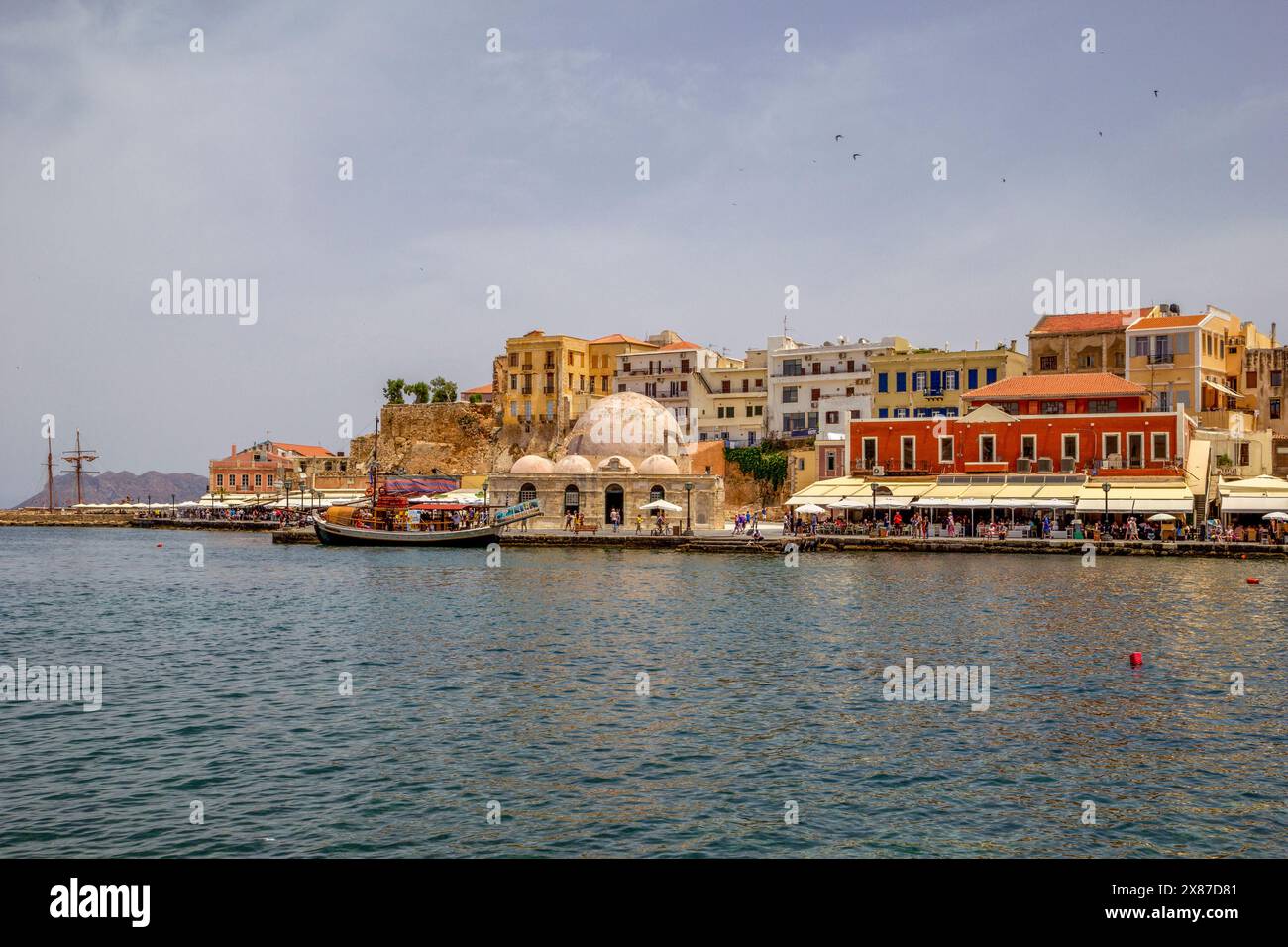 Greece, Crete, Chania, Harbor of coastal city with Kucuk Hasan Pasha ...