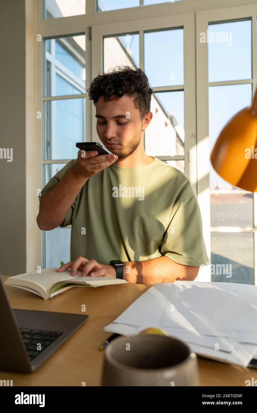 Young man photographing book hi-res stock photography and images - Alamy